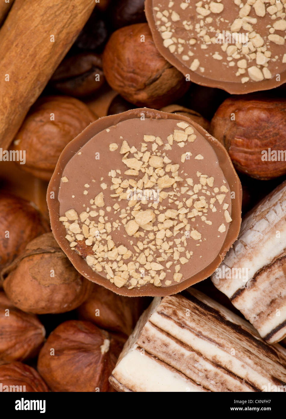 Closeup of coffee beans, cinnamon and nuts Stock Photo - Alamy