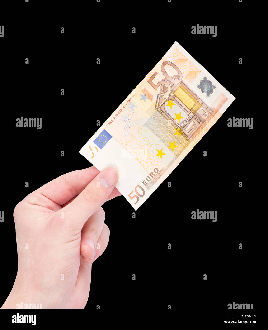Money (Euro) in a hand isolated on black Stock Photo - Alamy