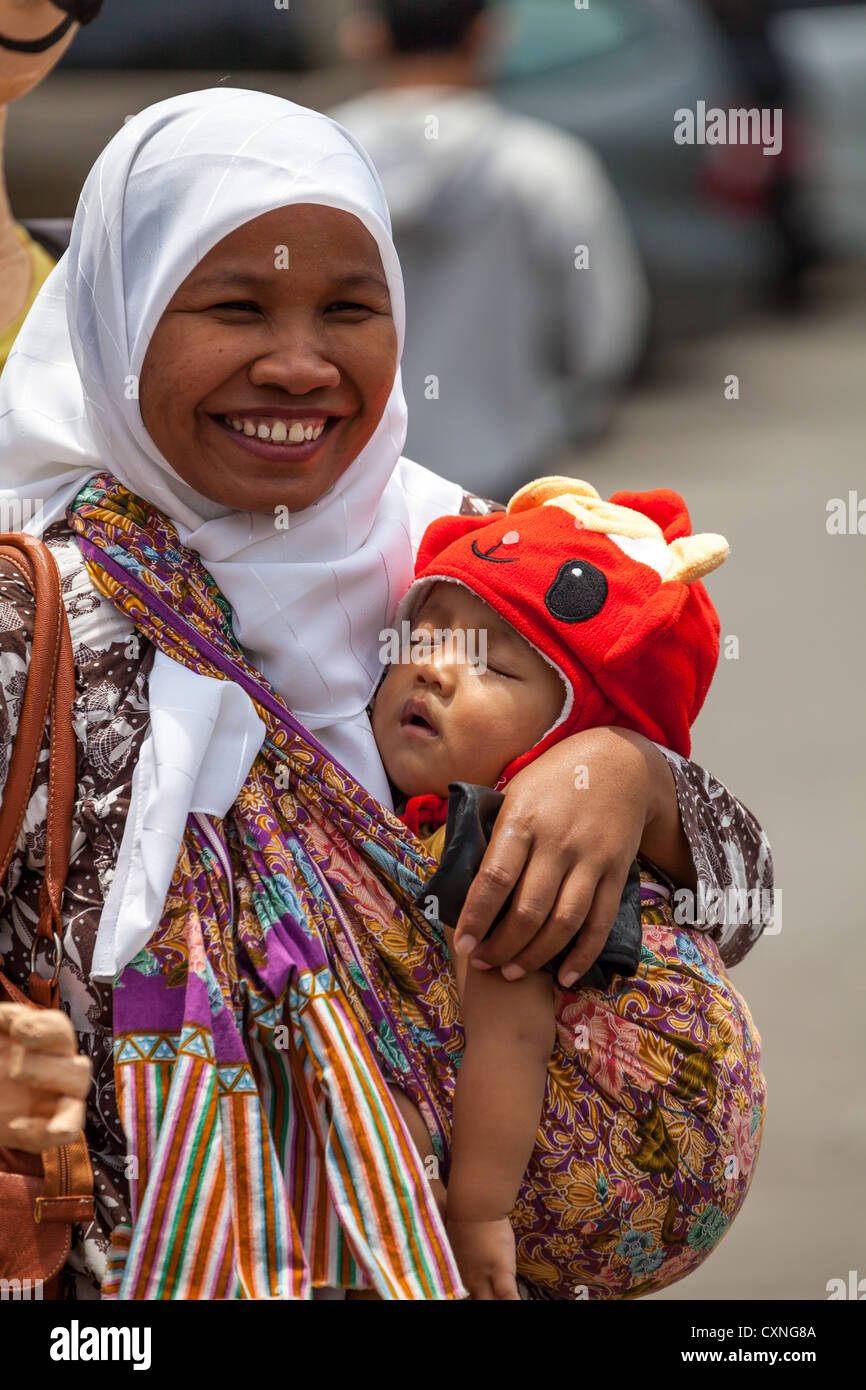 Mother with little Child in Yogyakarta in Indonesia Stock Photo - Alamy