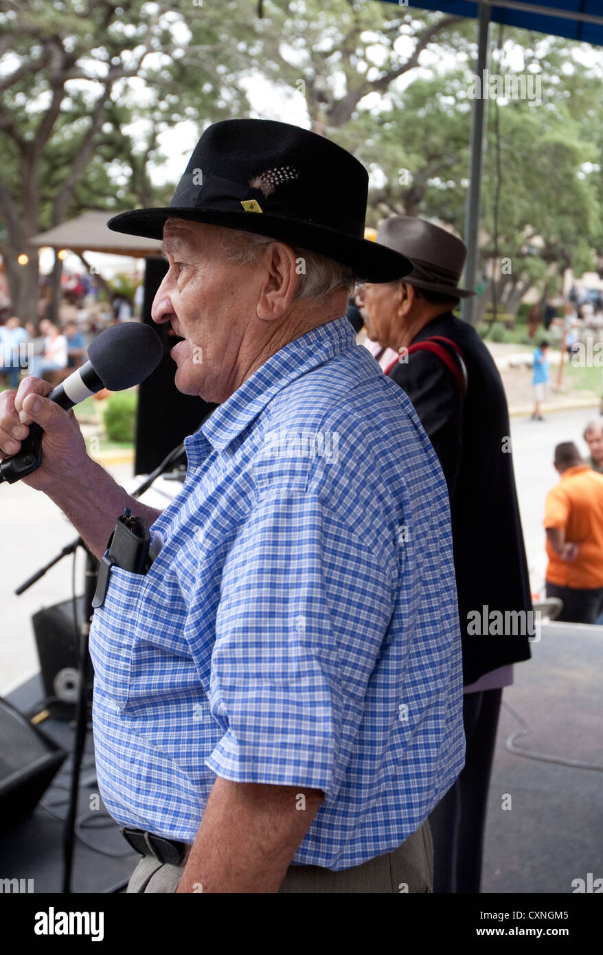 Mexican-American senior sings with a Tejano style music group at a ...