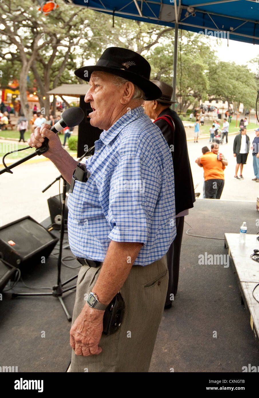 Mexican-American senior sings with a Tejano style music group at a ...