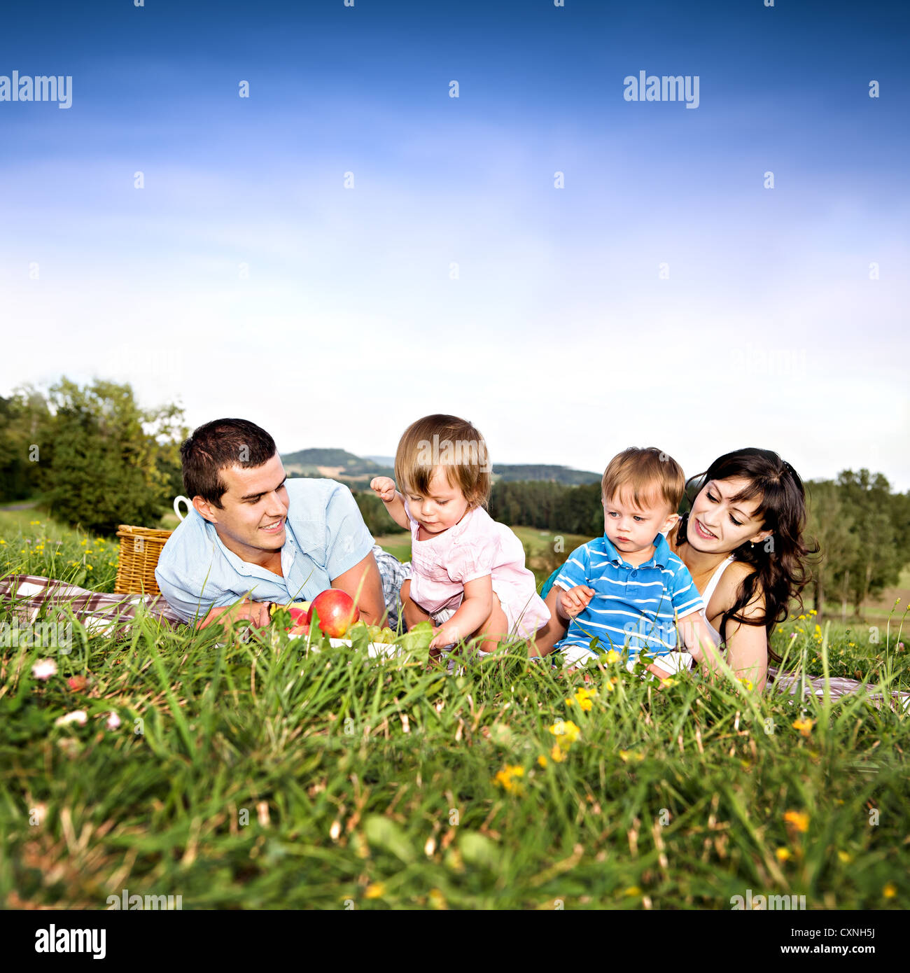 young family on the meadow at sunny day Stock Photo - Alamy