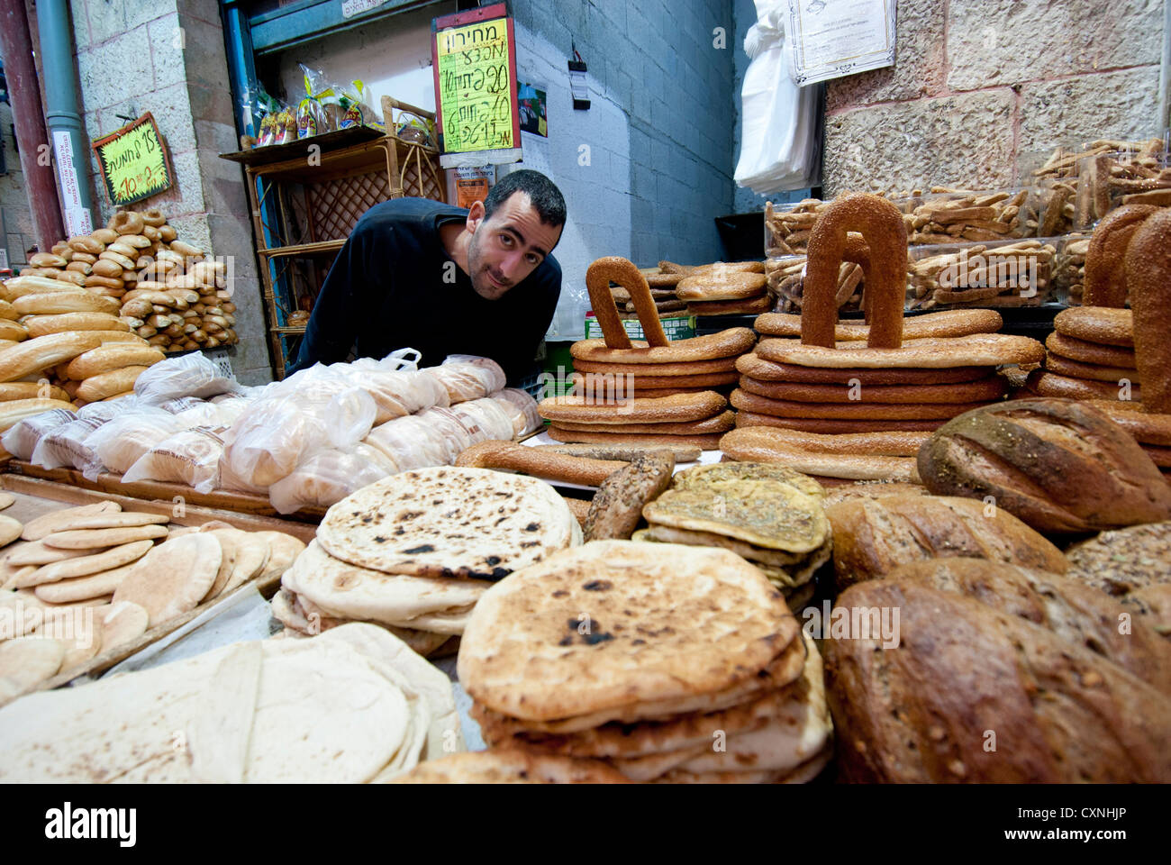 Israel, Jerusalem, bread store owner at the Mahane Yehuda Market or ...