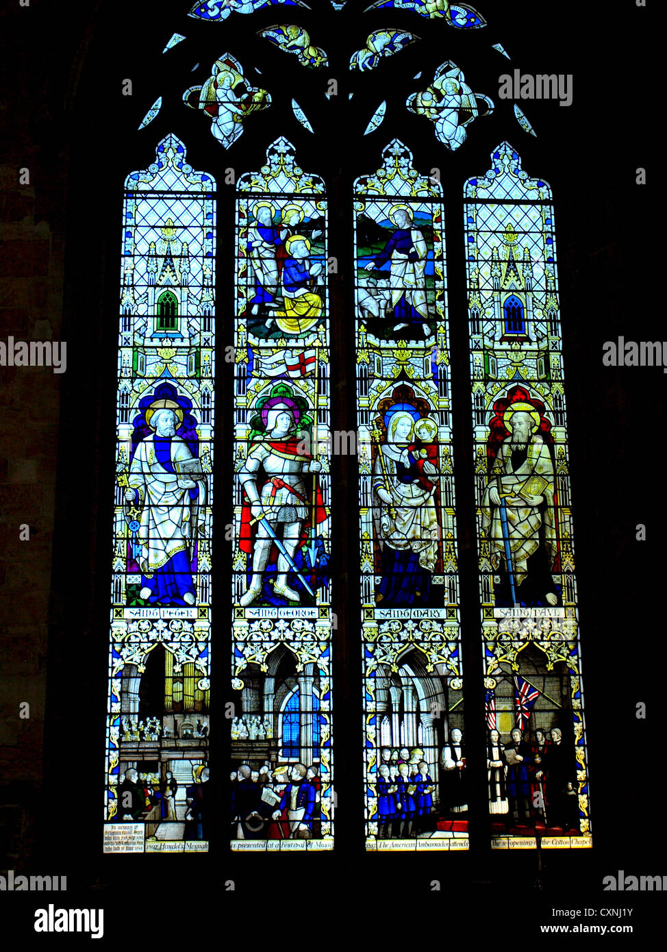 A stained glass window depicting Saints and church events at St ...