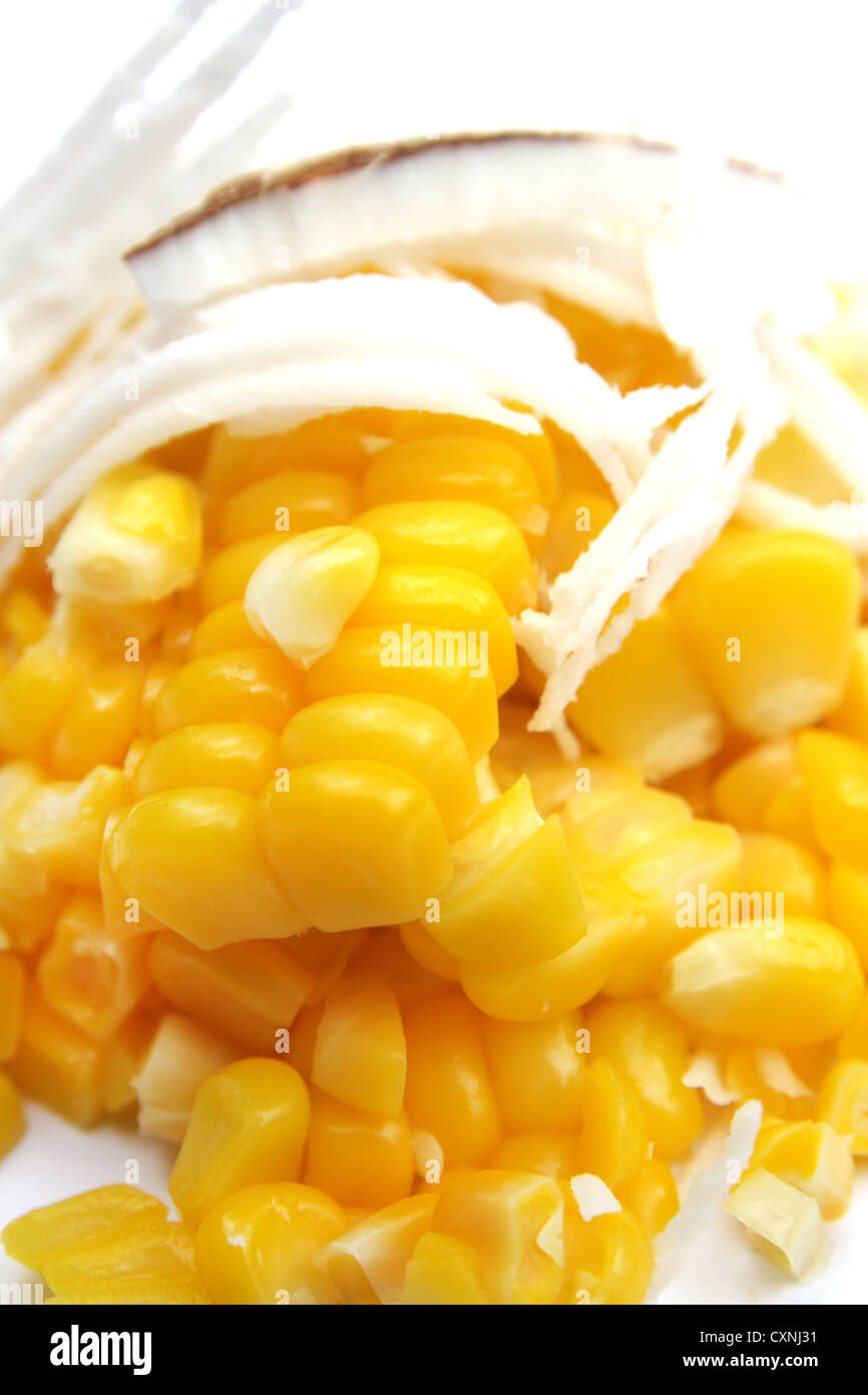 Corn with sliced coconut on white background Stock Photo - Alamy