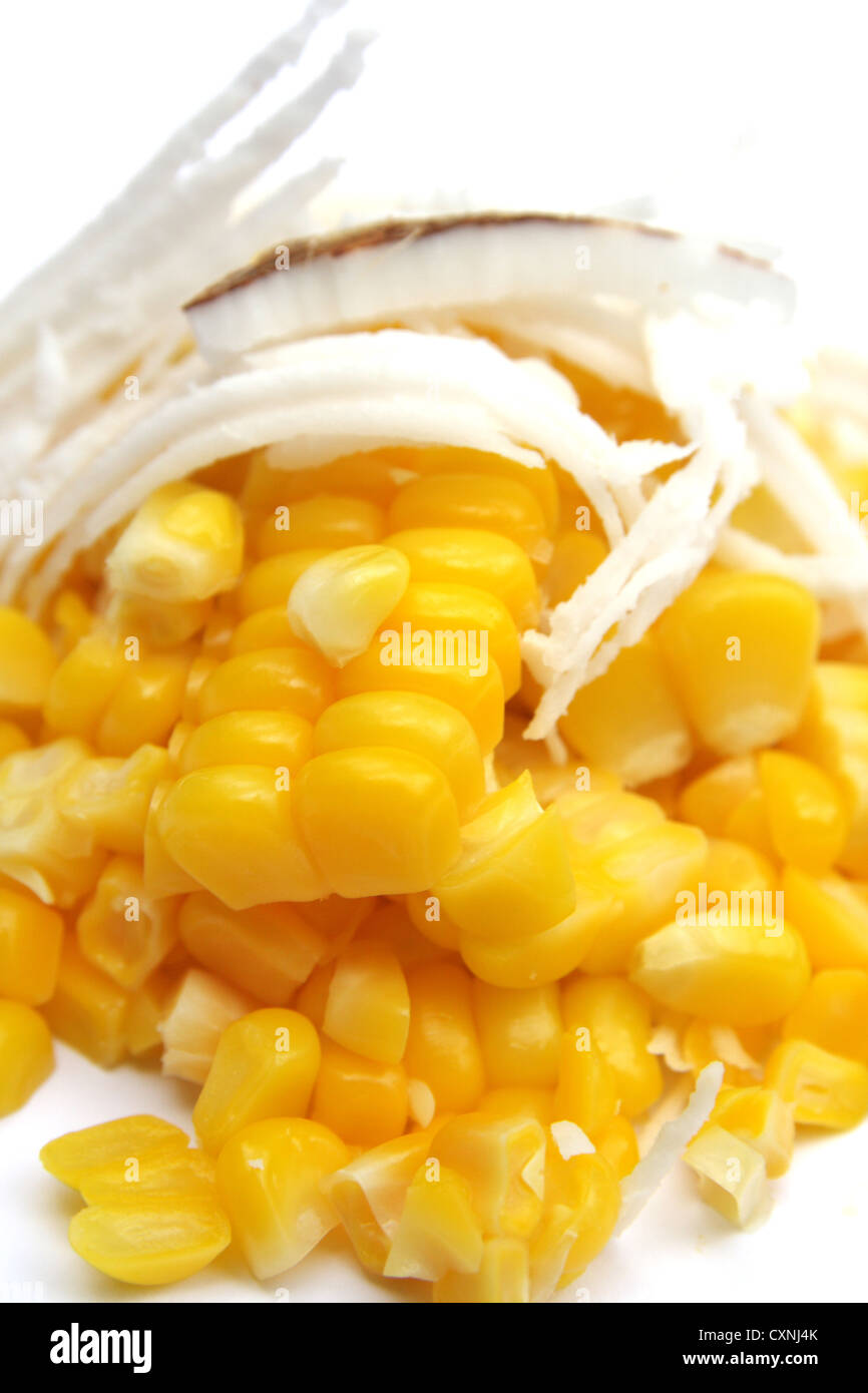 Corn with sliced coconut on white background Stock Photo - Alamy