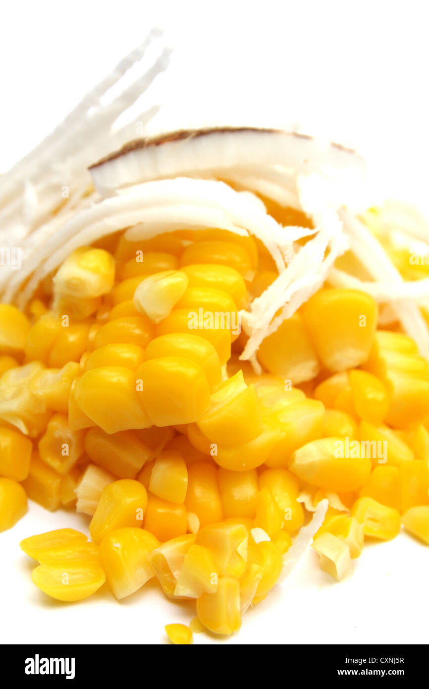Corn with sliced coconut on white background Stock Photo - Alamy