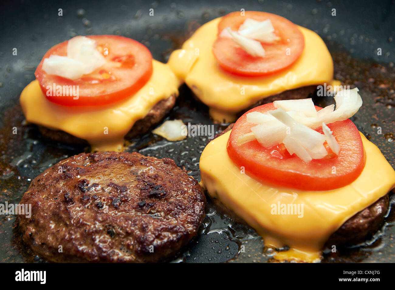 Burger in a pan Stock Photo - Alamy