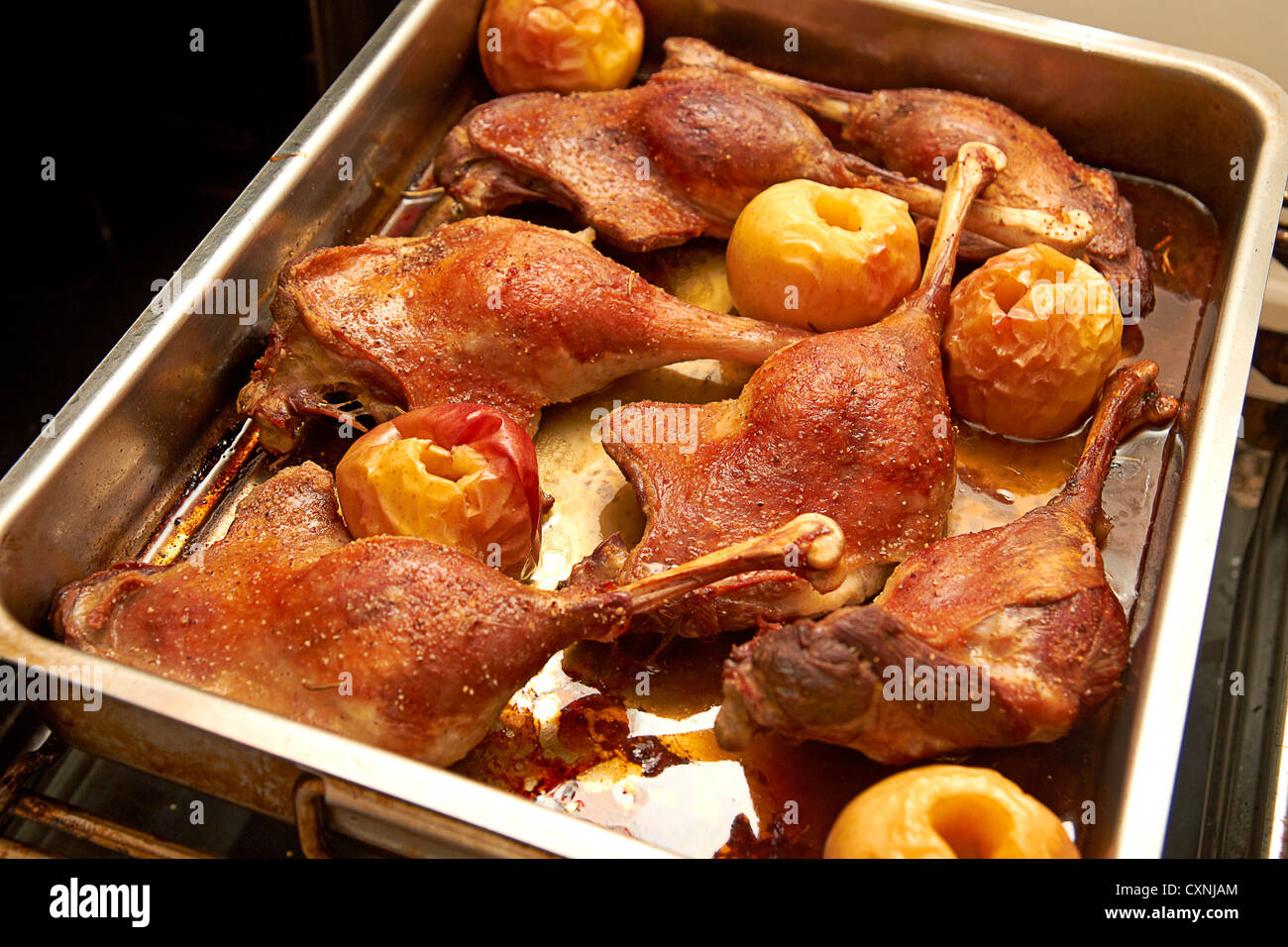 Roasted goose drumsticks in a baking oven Stock Photo - Alamy