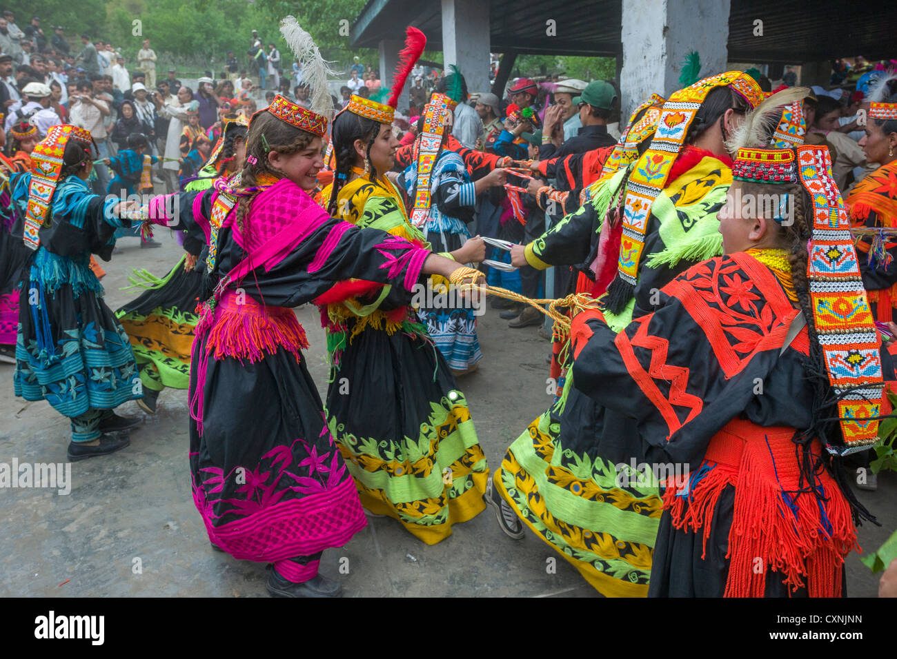 Kalash women and girls dancing wildly at the Anish Brun Village Charso ...