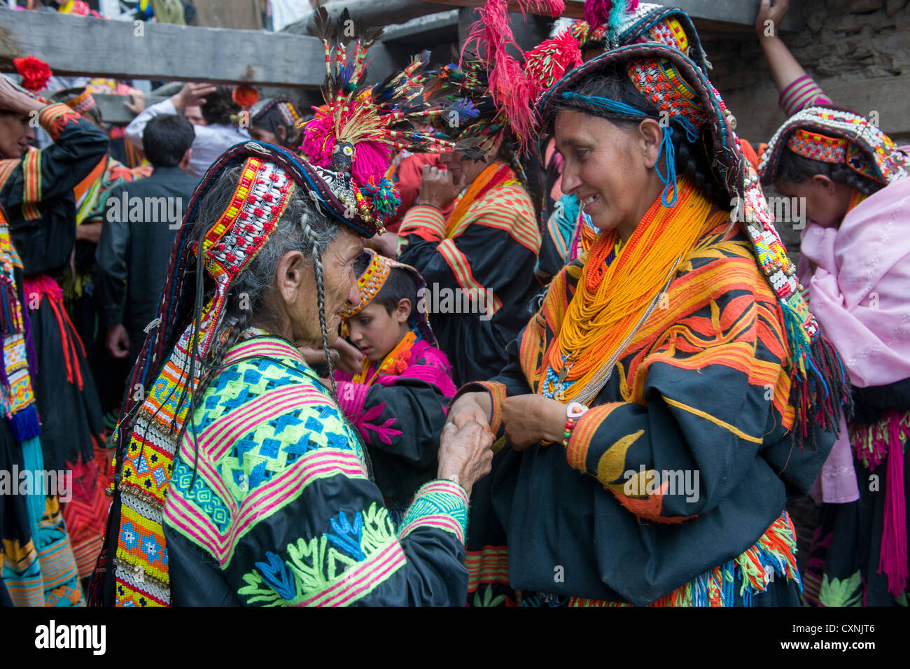 Kalash women greeting each other at the Anish Brun Village Charso ...