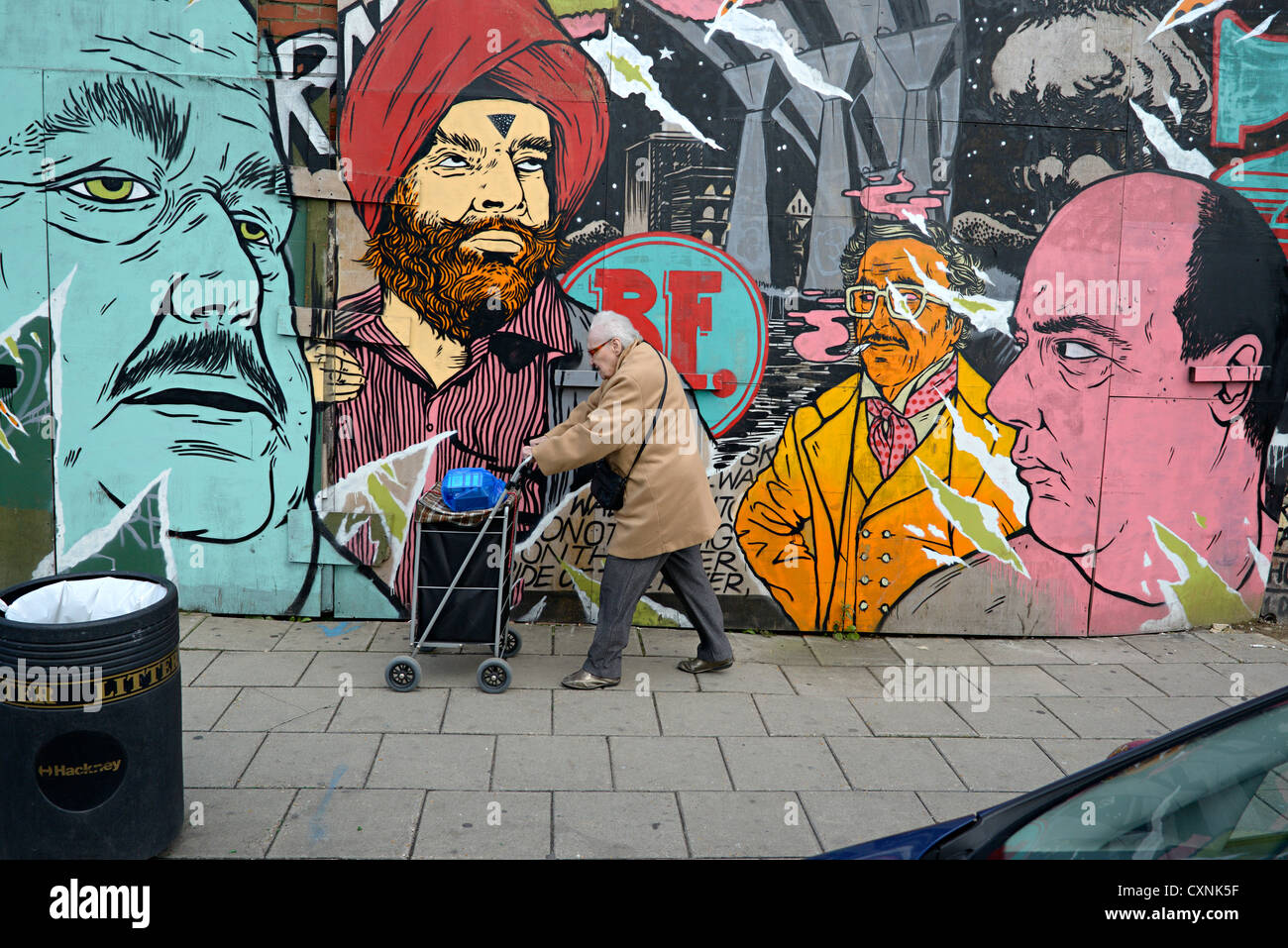 hackney road street art and woman east london Stock Photo - Alamy