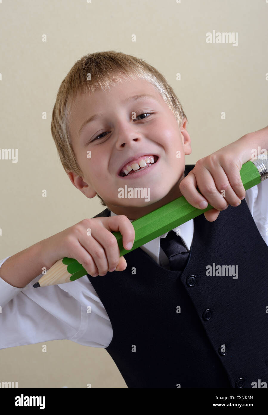 brave schoolboy with big pencil Stock Photo - Alamy