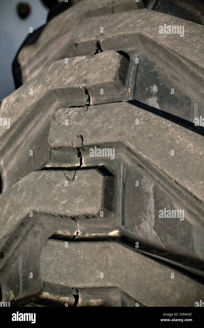 Giant old damaged truck tire. Vertical closeup shot Stock Photo - Alamy