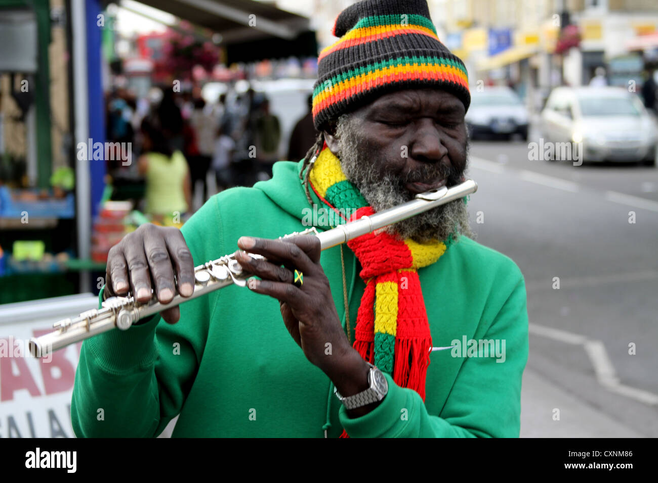 Flute Player flutewise playing in london, in vibrant rastafarian ...