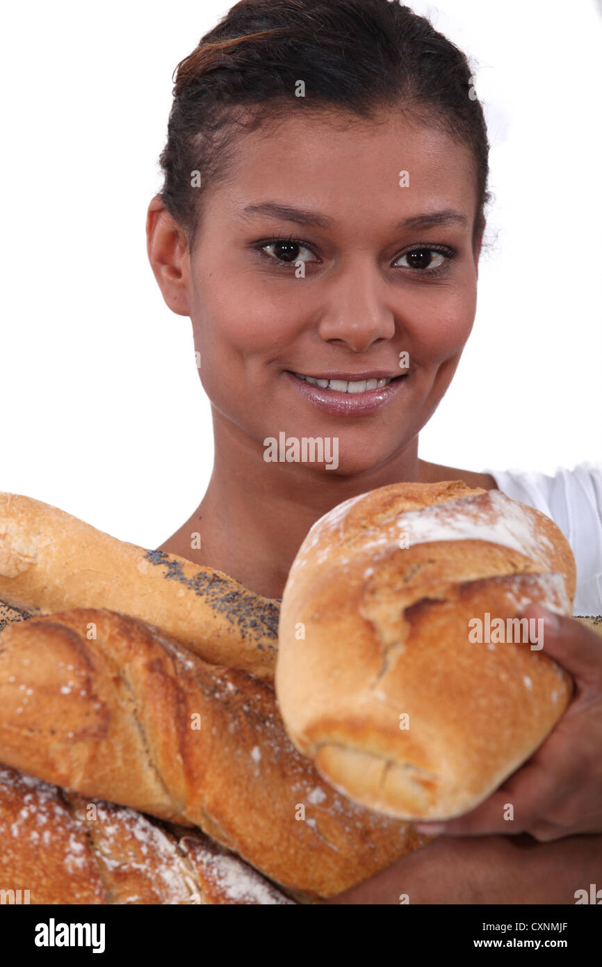 Boy with loaves of bread Stock Photo - Alamy