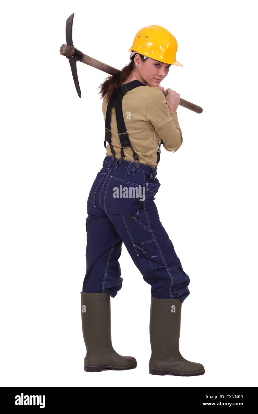 Woman holding pick axe Stock Photo - Alamy