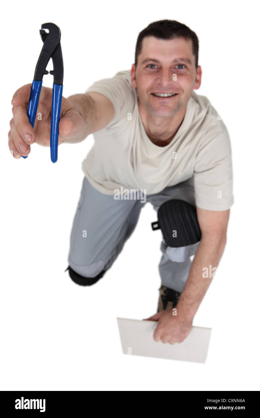 Workman with a pair of pliers Stock Photo - Alamy