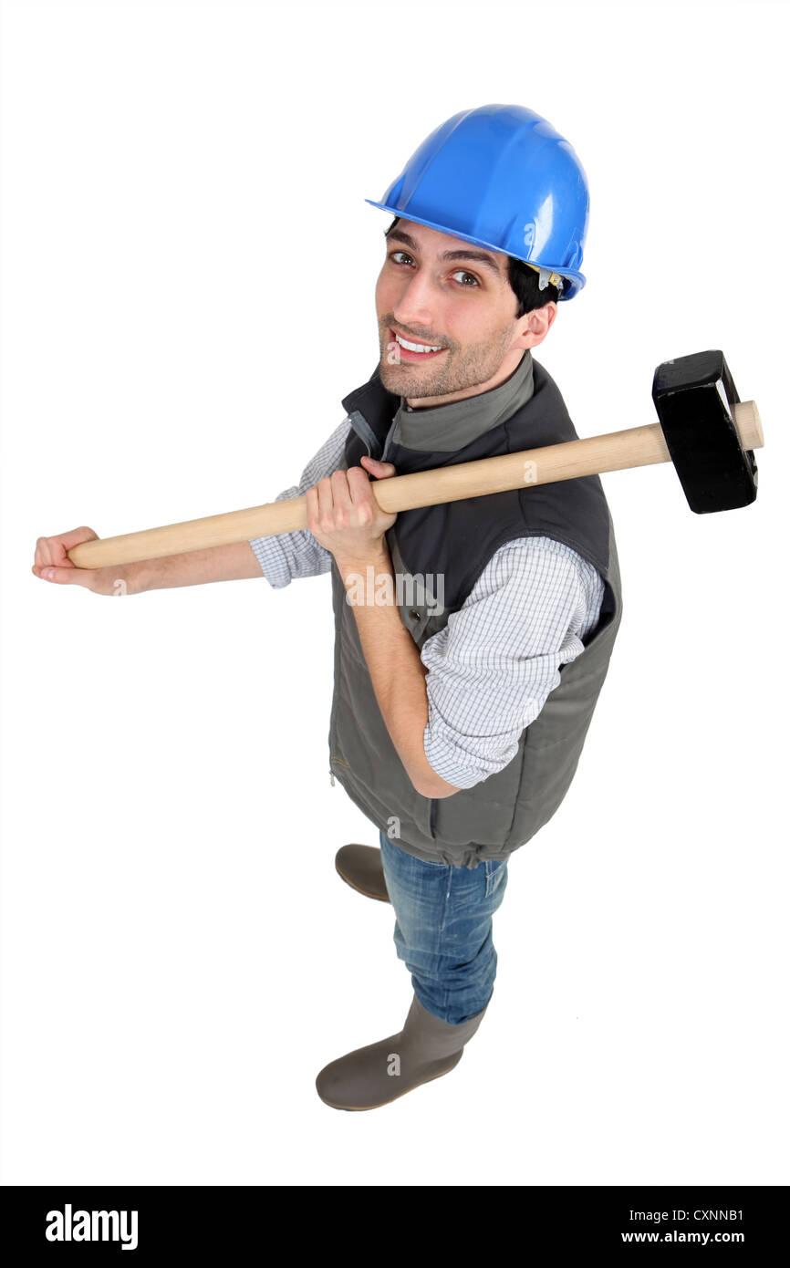 Man posing with sledge hammer Stock Photo - Alamy