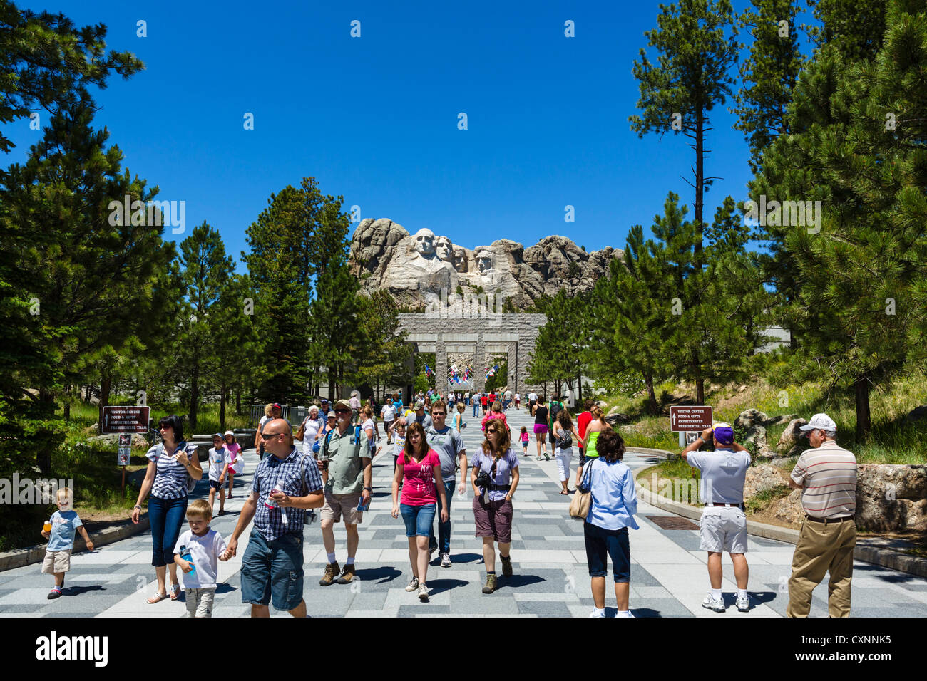 Tourists at the Mount Rushmore National Memorial on the path leading to ...