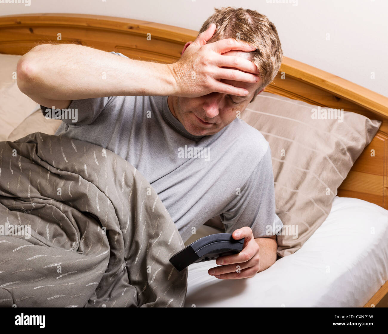 Mature man cannot sleep at night due to insomnia Stock Photo - Alamy