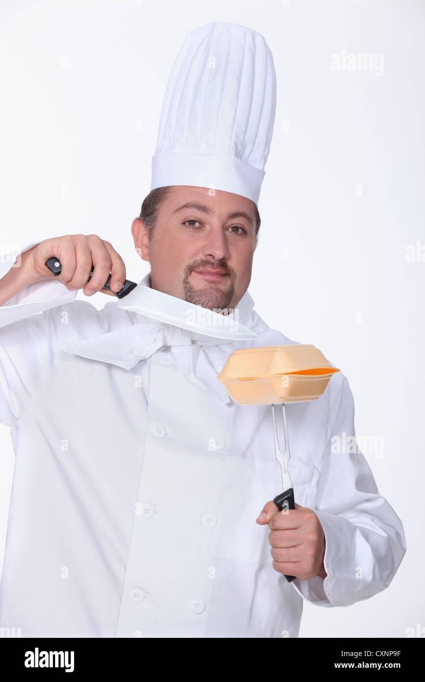 chef cutting a hamburger box with a big knife Stock Photo - Alamy
