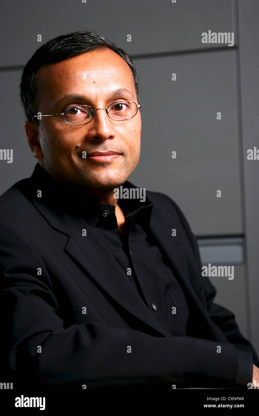 Portrait of professional sat at desk Stock Photo - Alamy