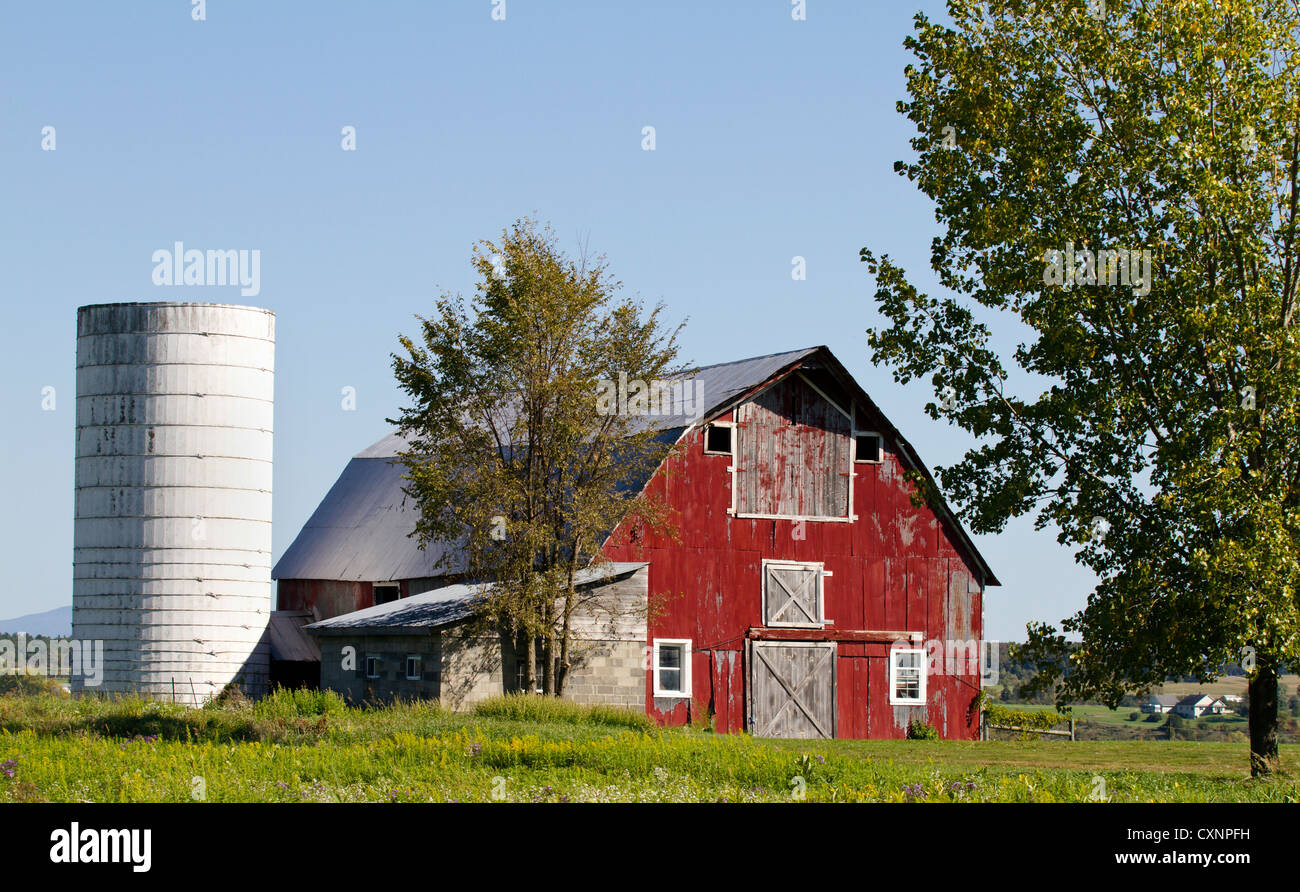 An old vintage abandoned barn and silo Stock Photo - Alamy