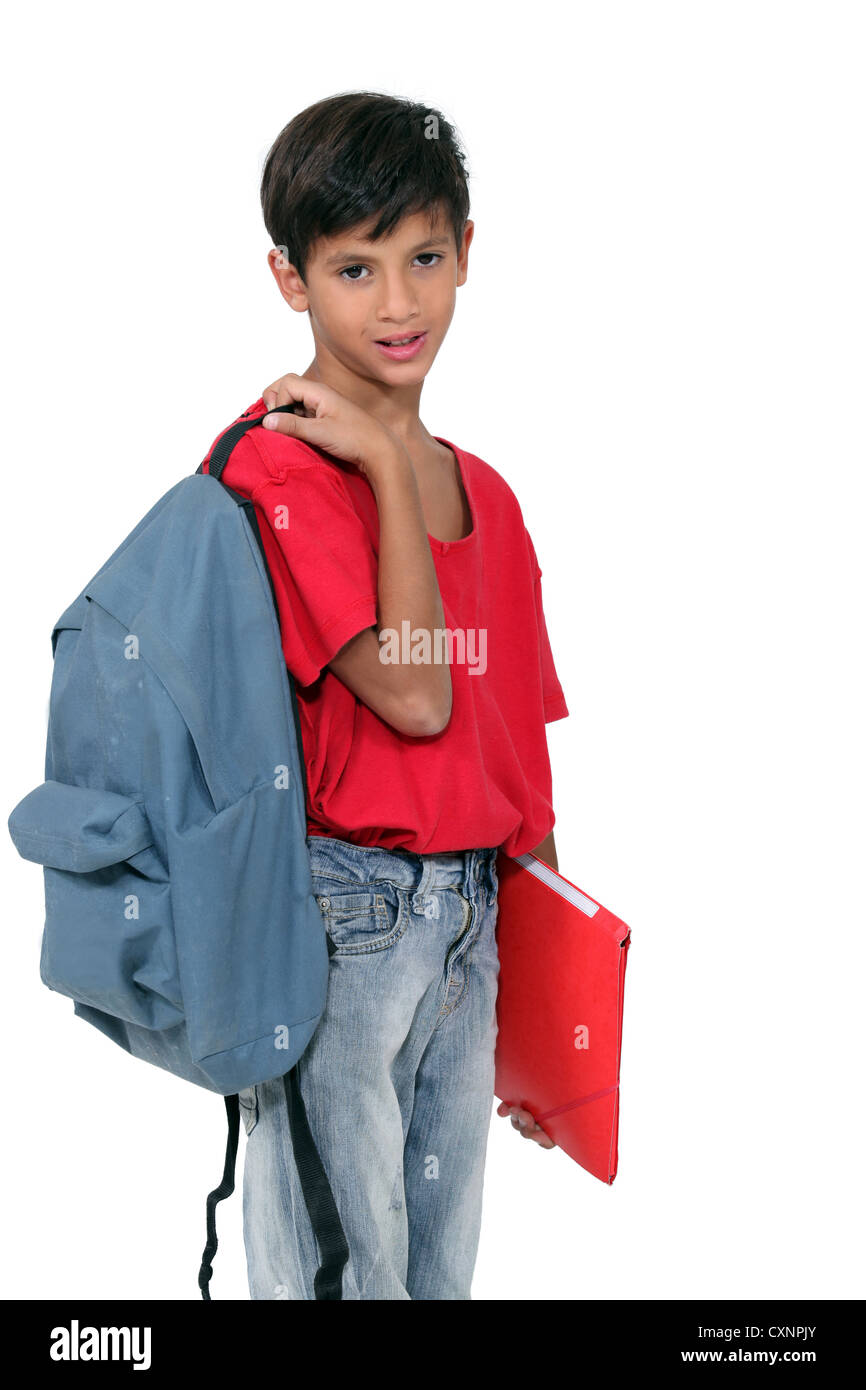 little schoolboy holding a backpack and a file folder Stock Photo - Alamy