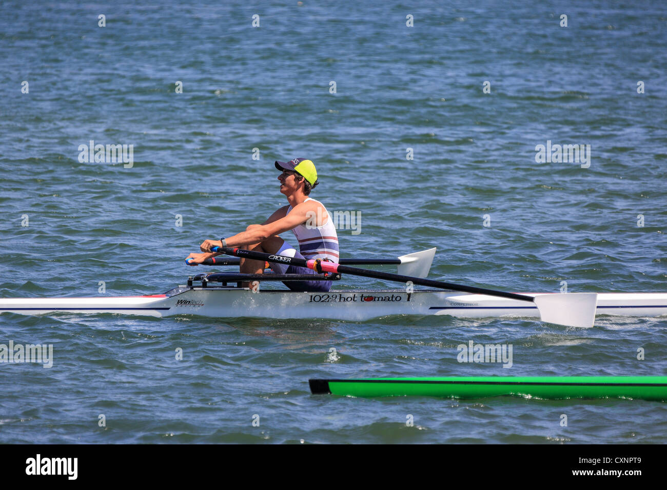 single rower at University river regatta rowing for trophies Surfers ...
