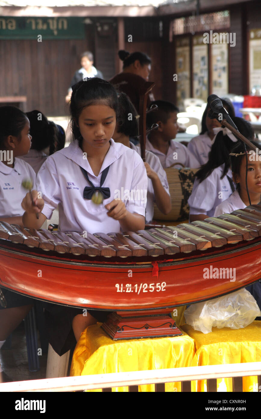 Thai student performing Ranat Ek (traditional Thai xylophone Stock ...