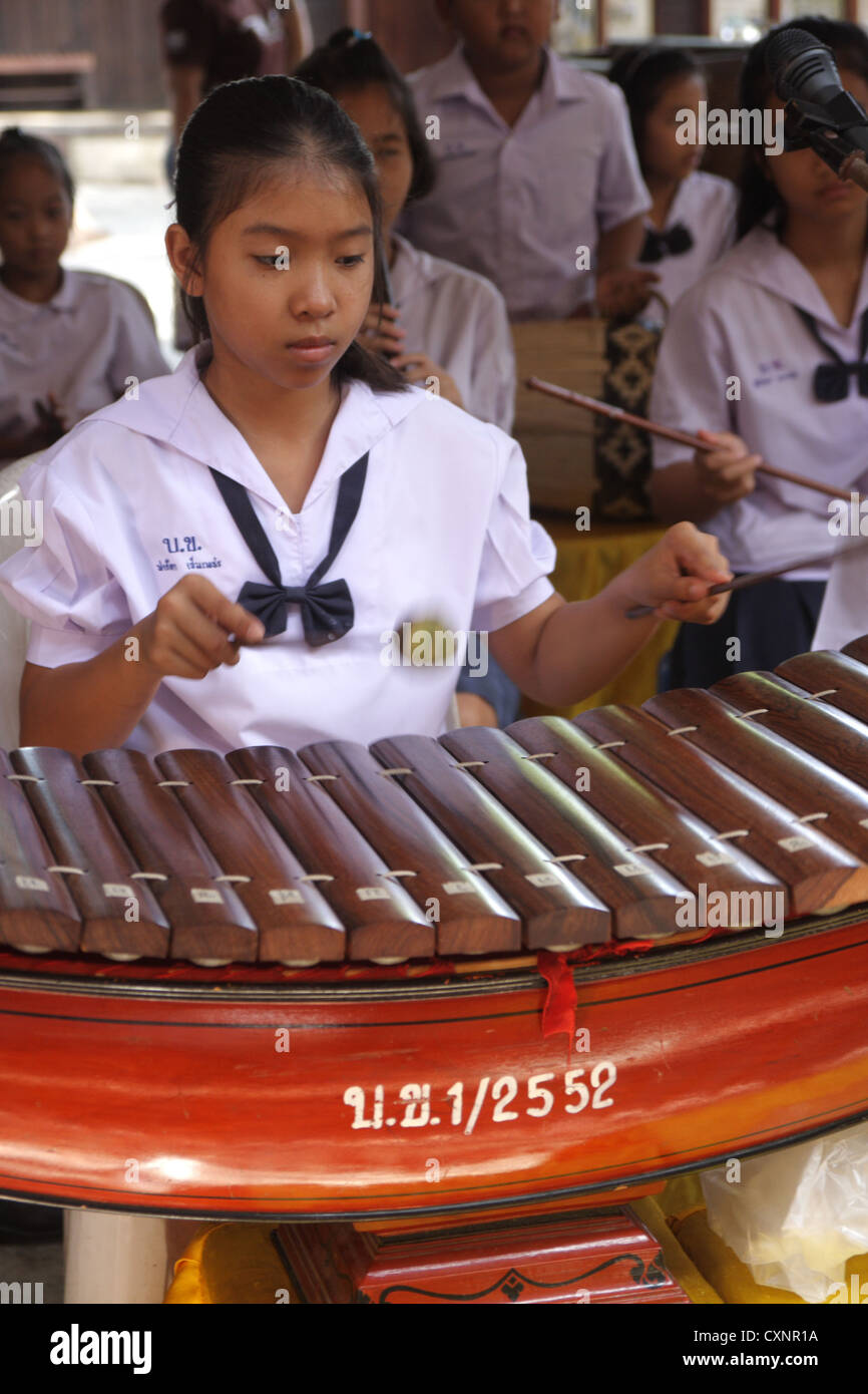 Thai student performing Ranat Ek (traditional Thai xylophone Stock ...