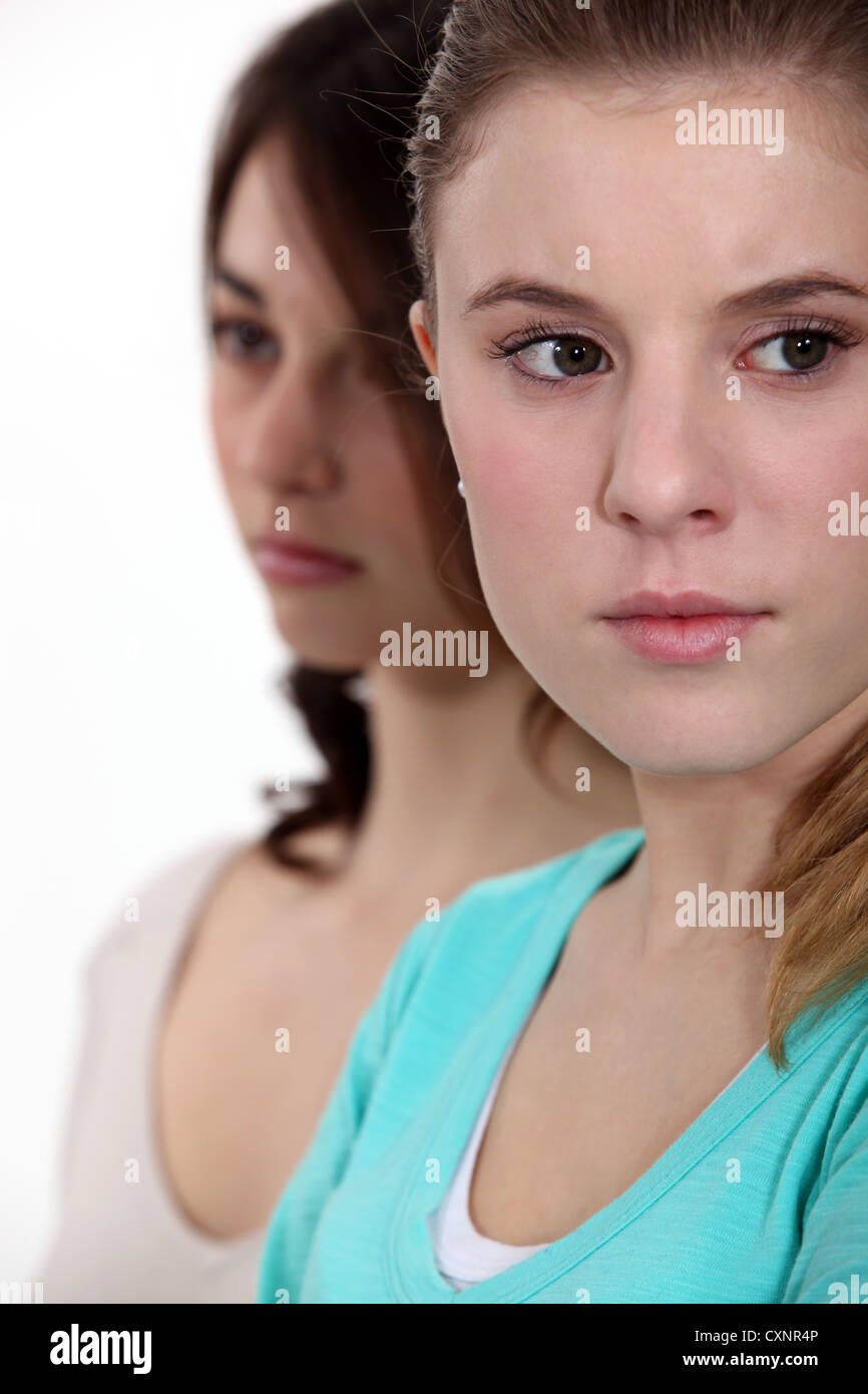 Two friends sulking at each other Stock Photo - Alamy