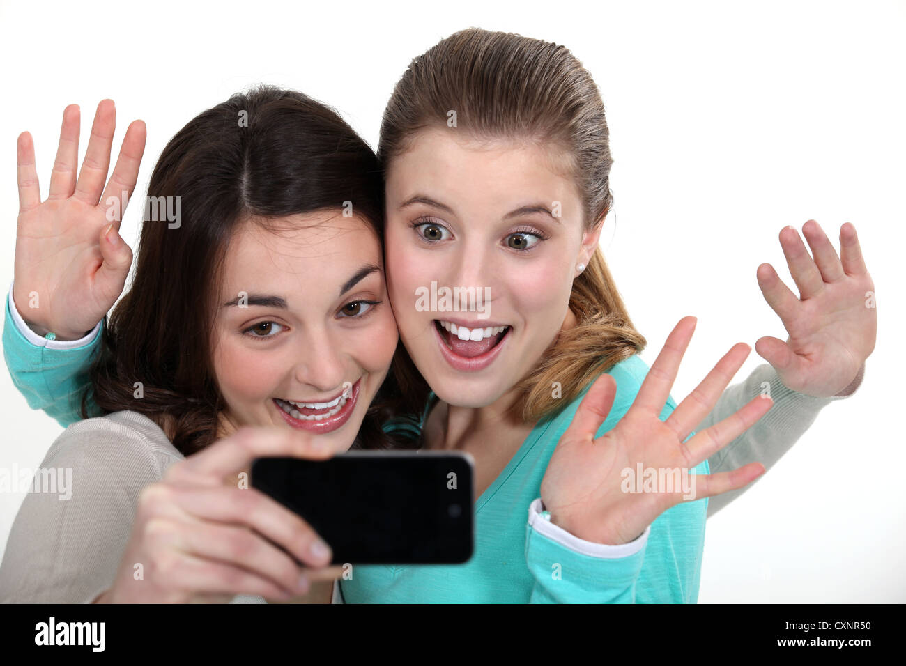 Teen girls using cell phone hi-res stock photography and images - Alamy