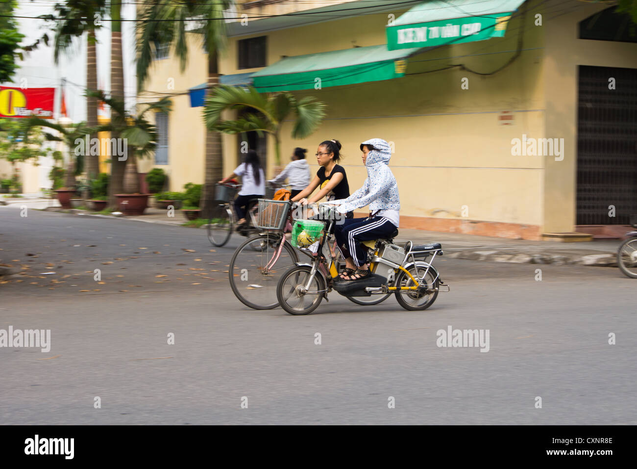 Two girls on bikes hi-res stock photography and images - Alamy
