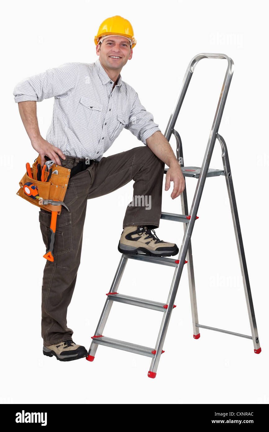 Handyman climbing ladder Stock Photo - Alamy