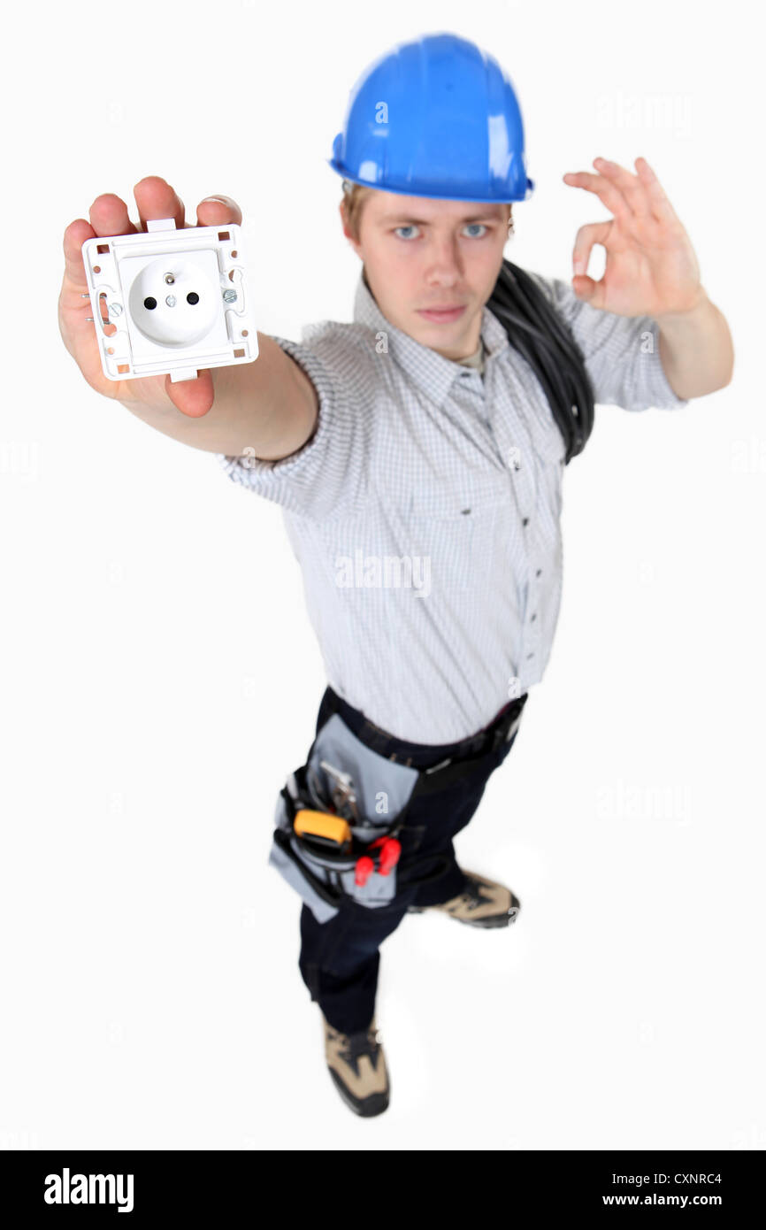 high angle shot of young electrician showing socket Stock Photo - Alamy