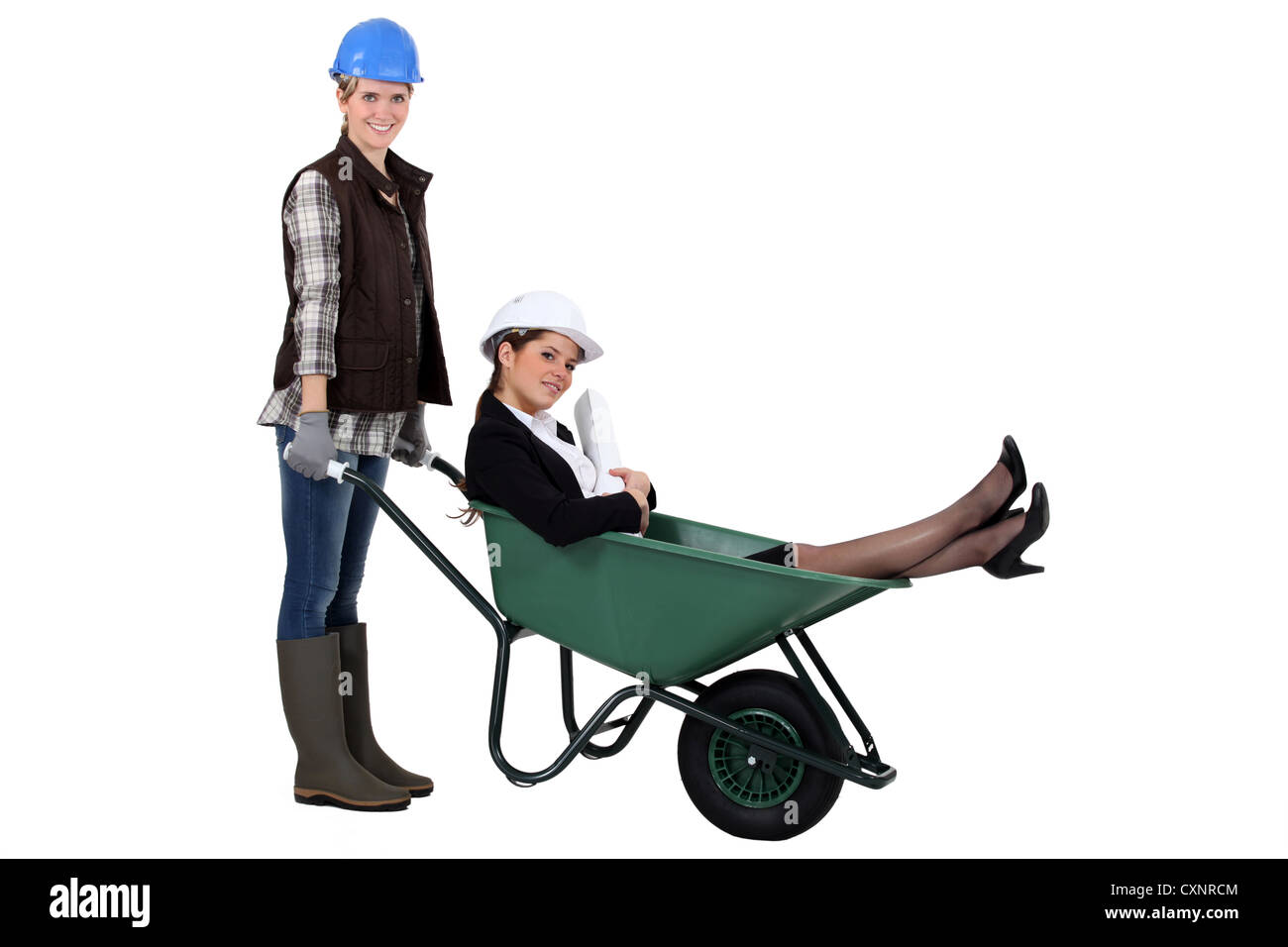 Worker pushing boss around in wheelbarrow Stock Photo - Alamy