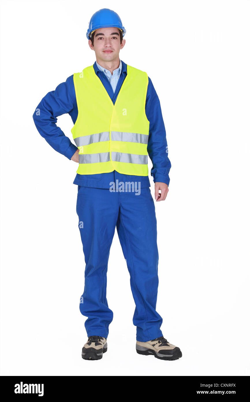 Construction worker standing on white background Stock Photo - Alamy