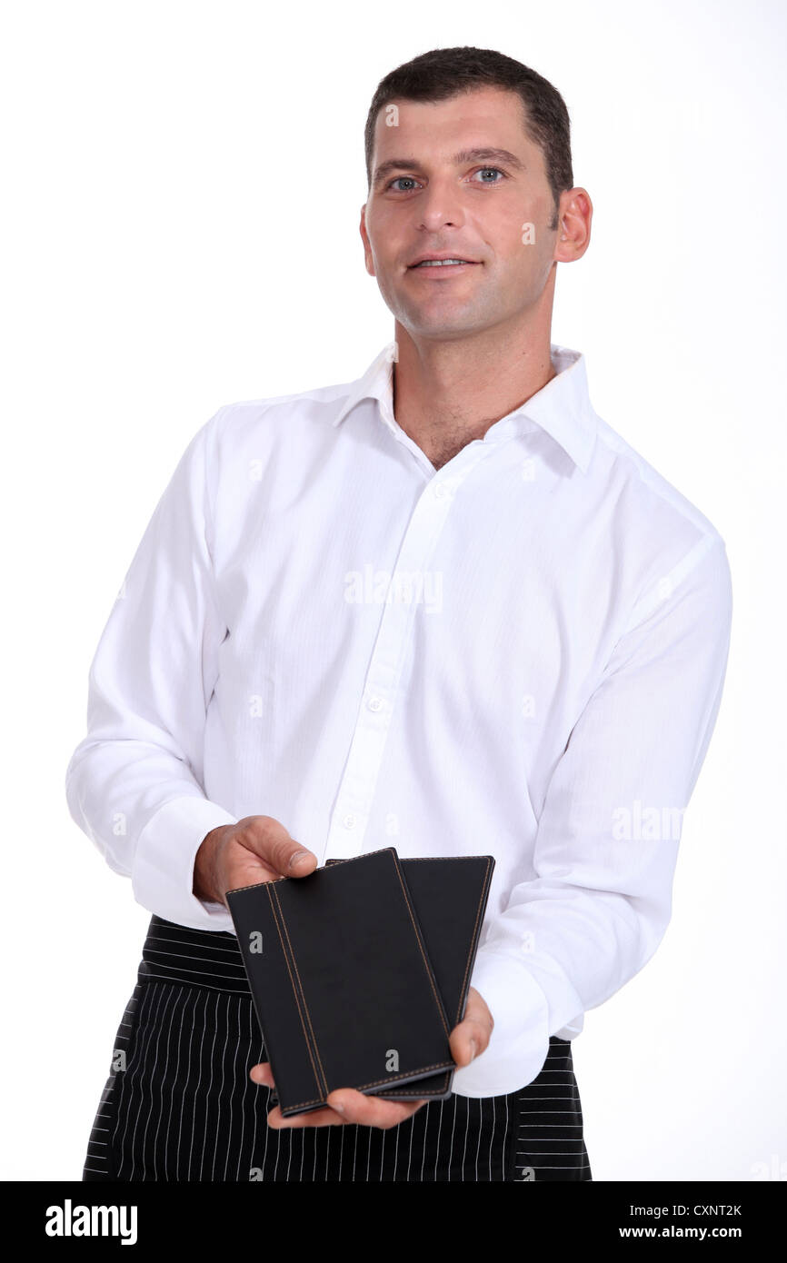 Waiter with menus Stock Photo - Alamy