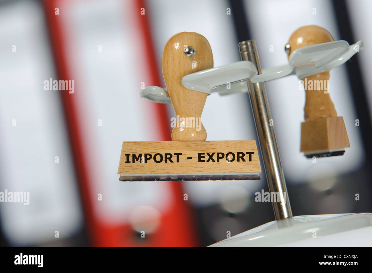 rubber stamp marked with import - export Stock Photo - Alamy