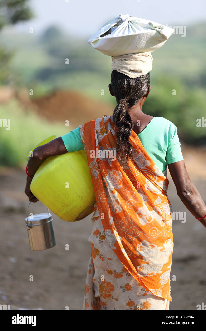 Indian woman carrying basket hi-res stock photography and images - Alamy