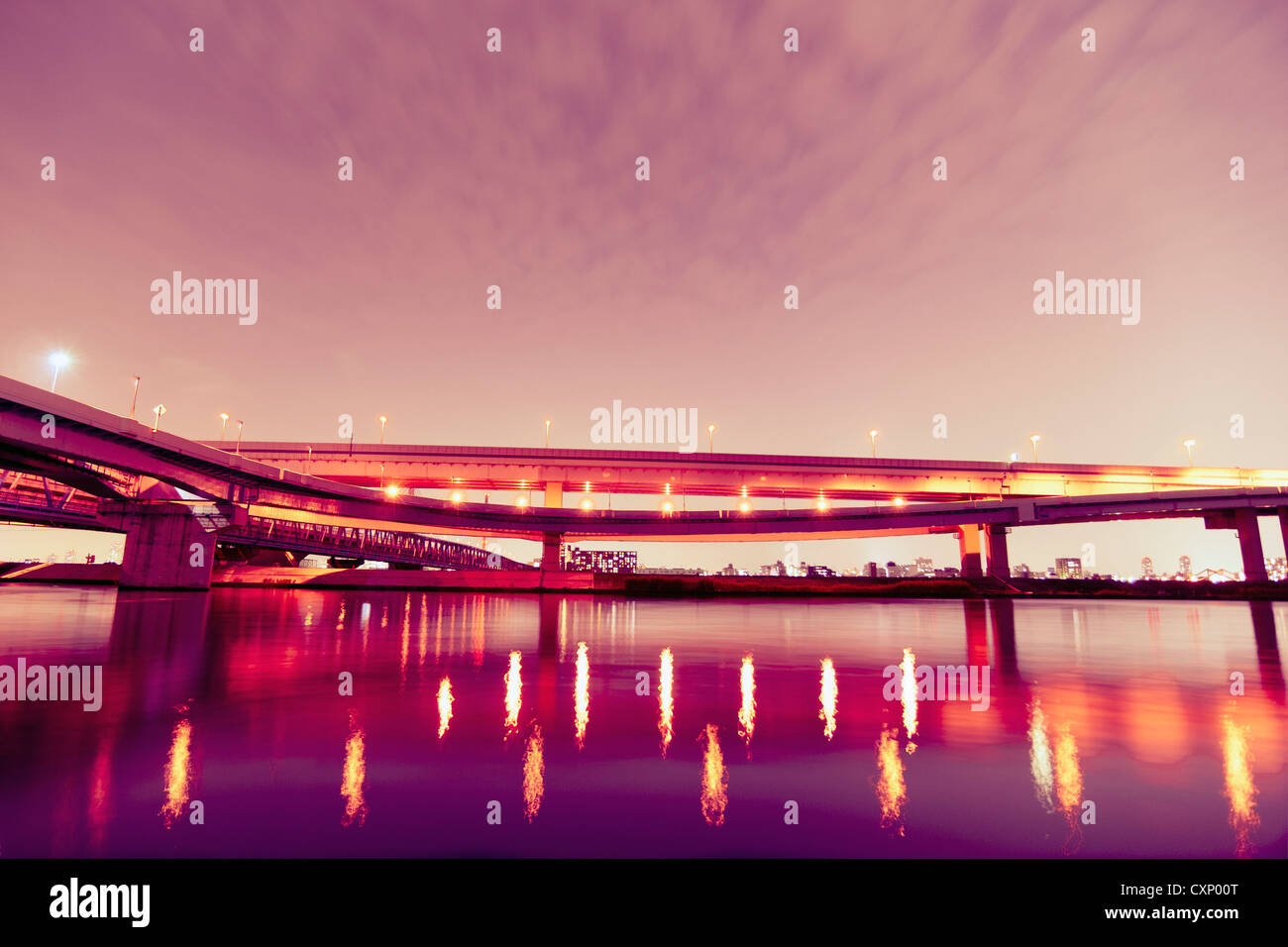 night highway with light reflections over Arakawa river in Tokyo Japan ...