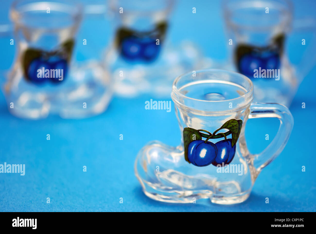 Set of dram glass on blue background Stock Photo - Alamy