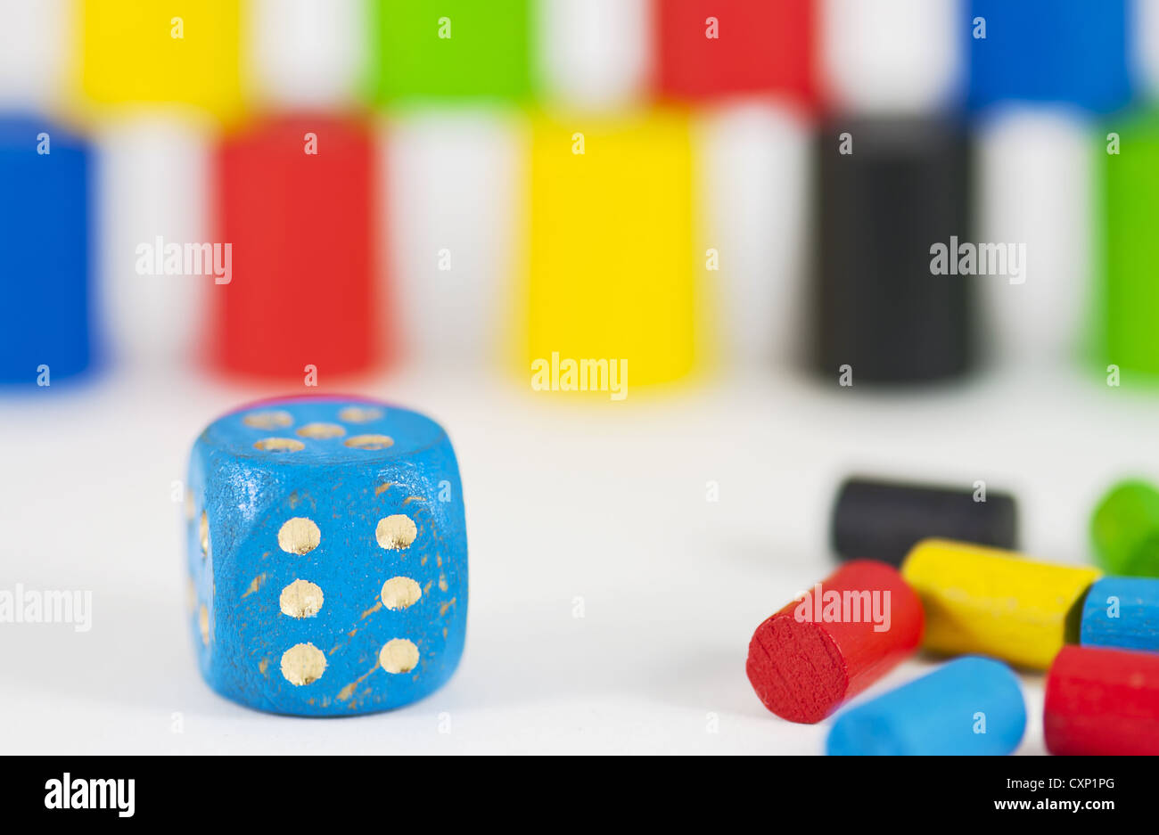 Detail of game cube with background of pieces Stock Photo - Alamy