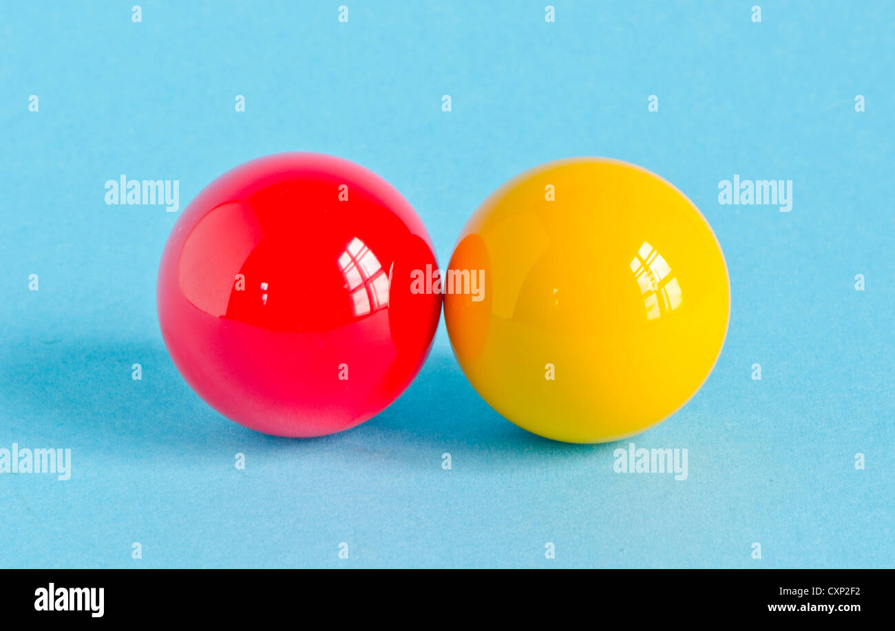 red and yellow billiards balls on azure background Stock Photo - Alamy