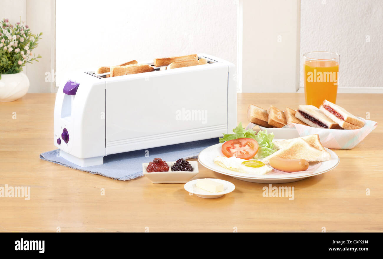 Bread toaster the necessary kitchen tool Stock Photo - Alamy