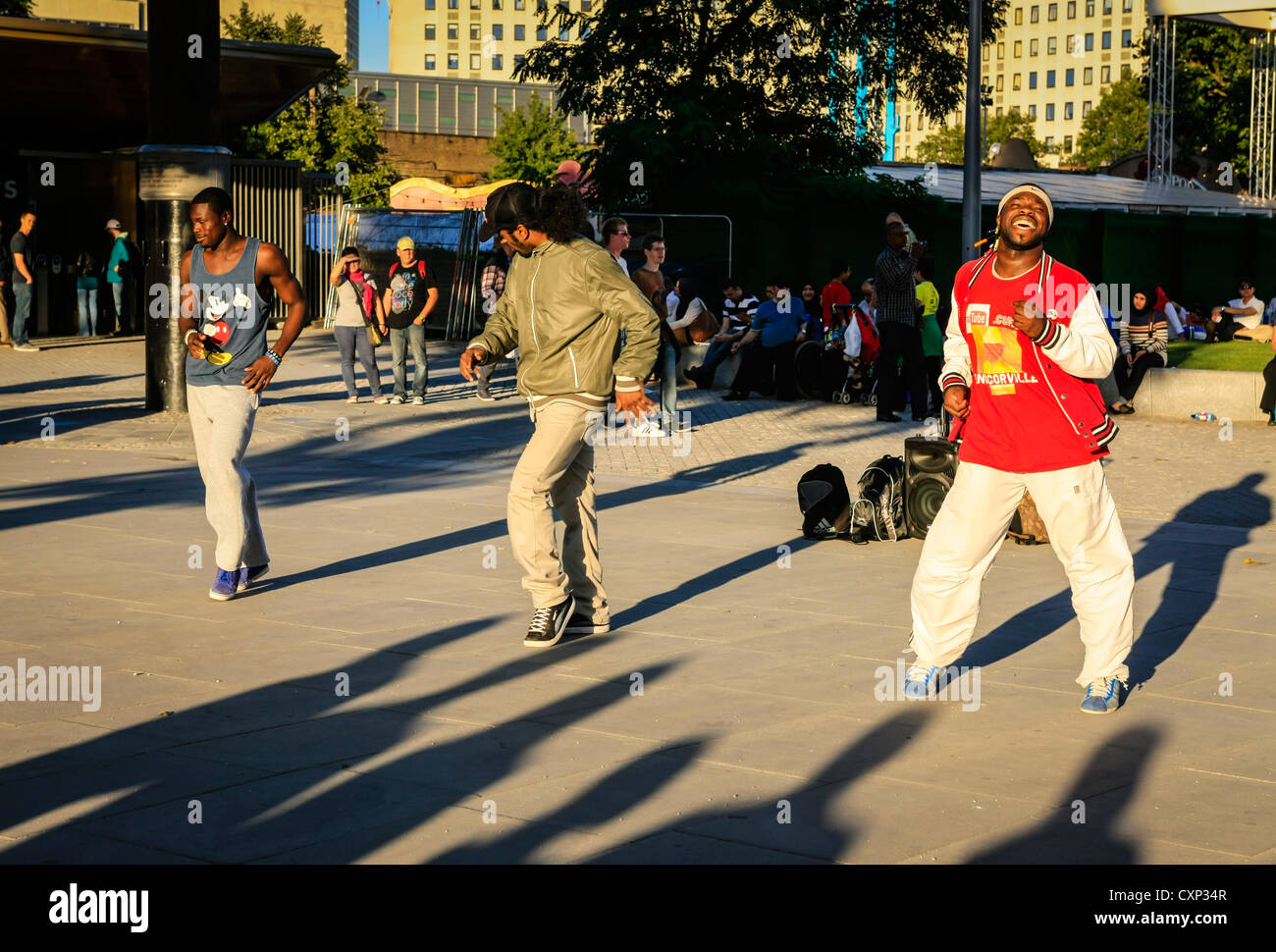 Three street performing guys dance a Gangster Rap routines in London ...