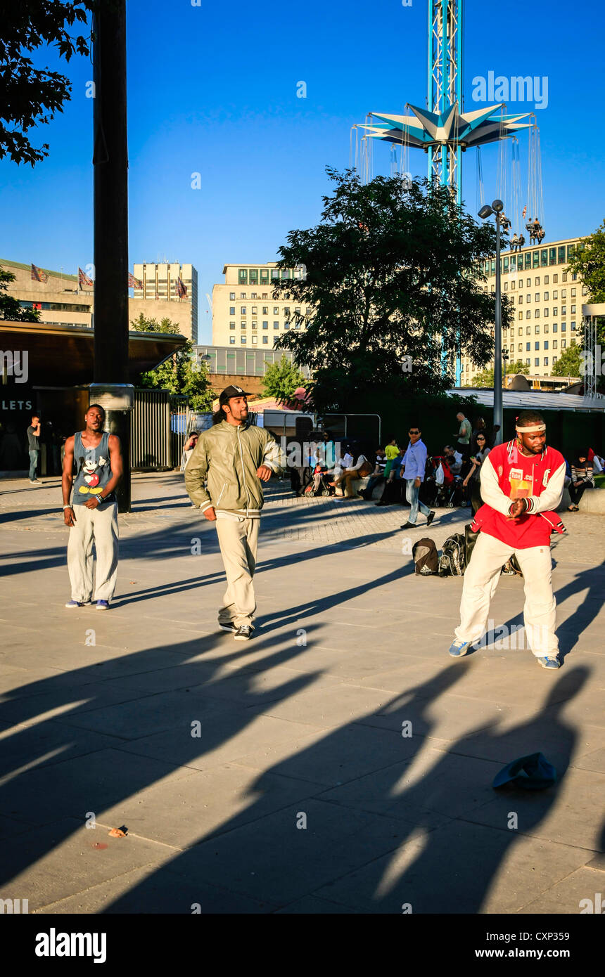Three street performing guys dance a Gangster Rap routines in London ...