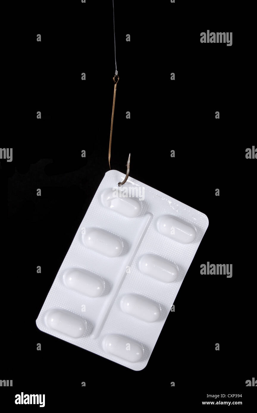 Drug packet on fishing hook against a black background Stock Photo - Alamy